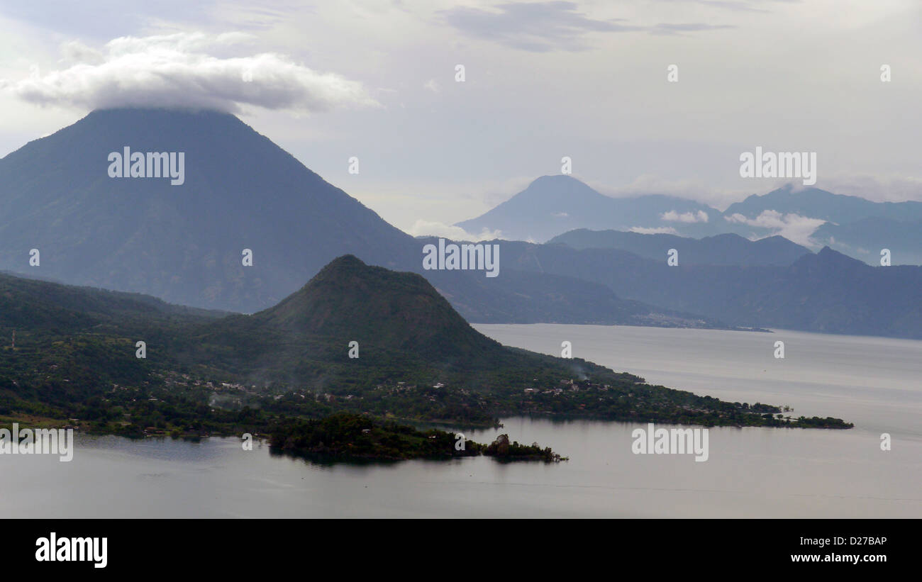 Guatemala - Lake Atitlan early morning, volcanoes in background Stock ...