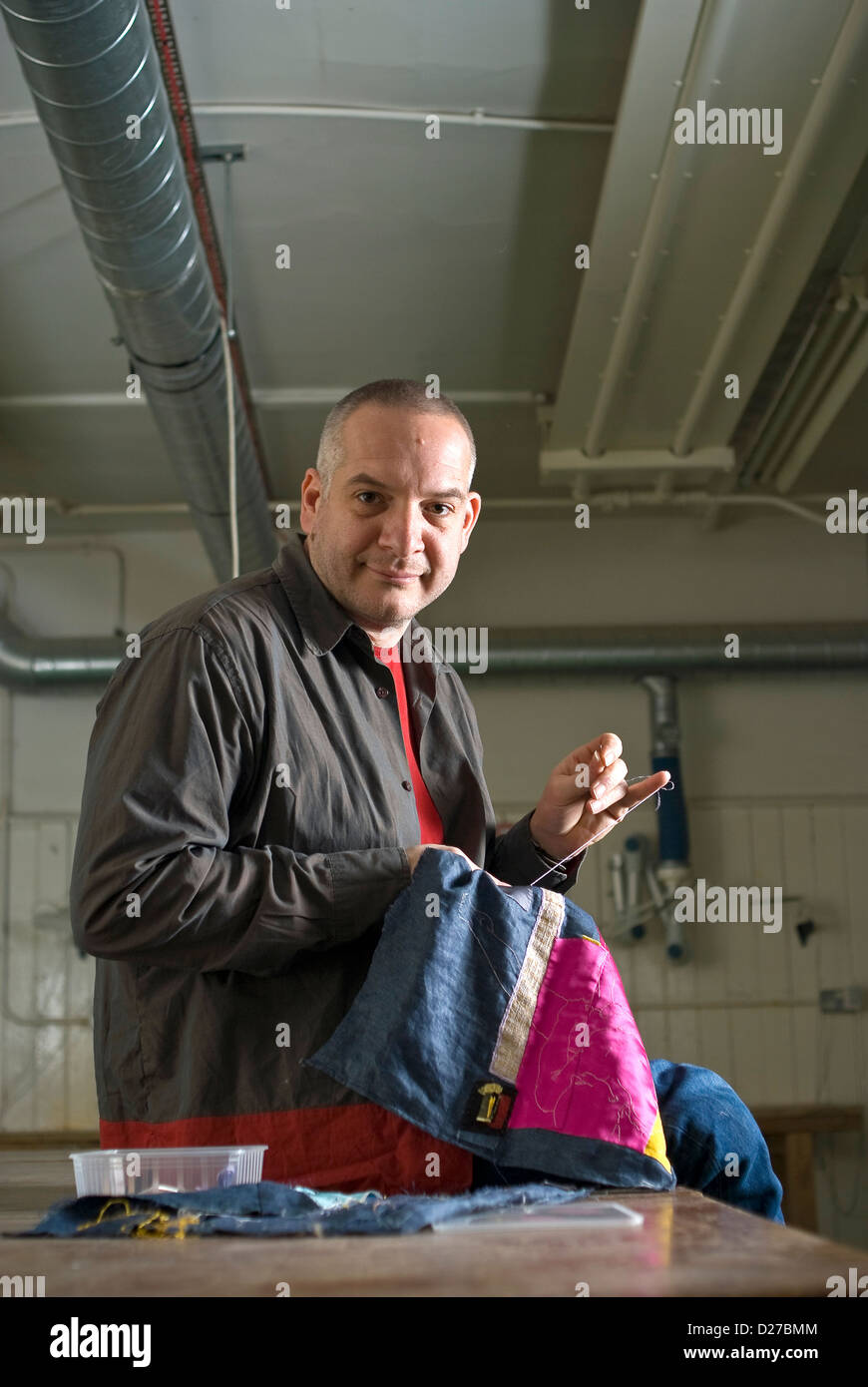Male embroidery artist working on an artwork at West Dean College ...