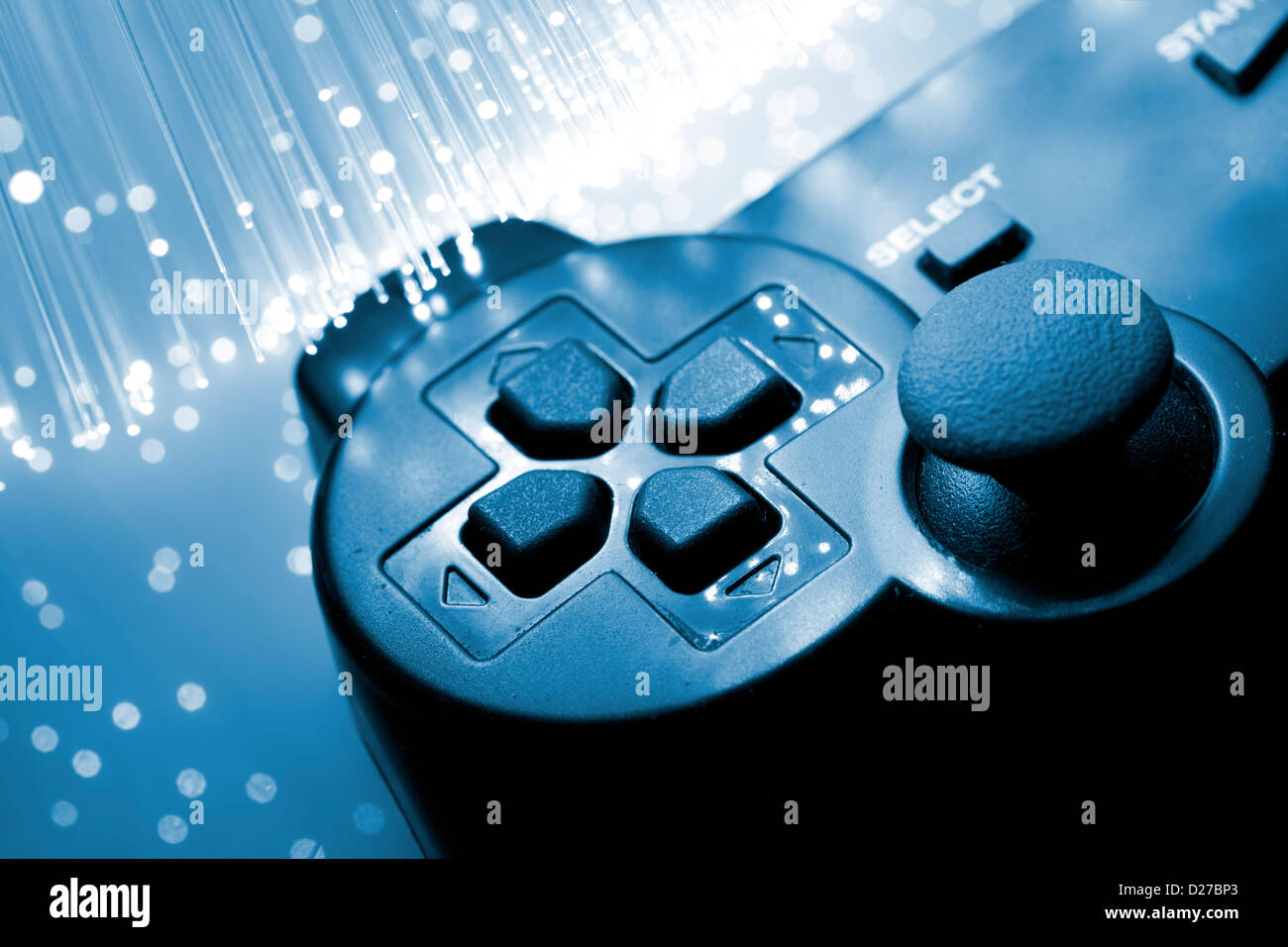 Game controller and blue light Stock Photo - Alamy