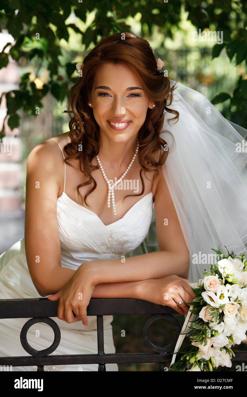 The beautiful bride on a green background Stock Photo - Alamy