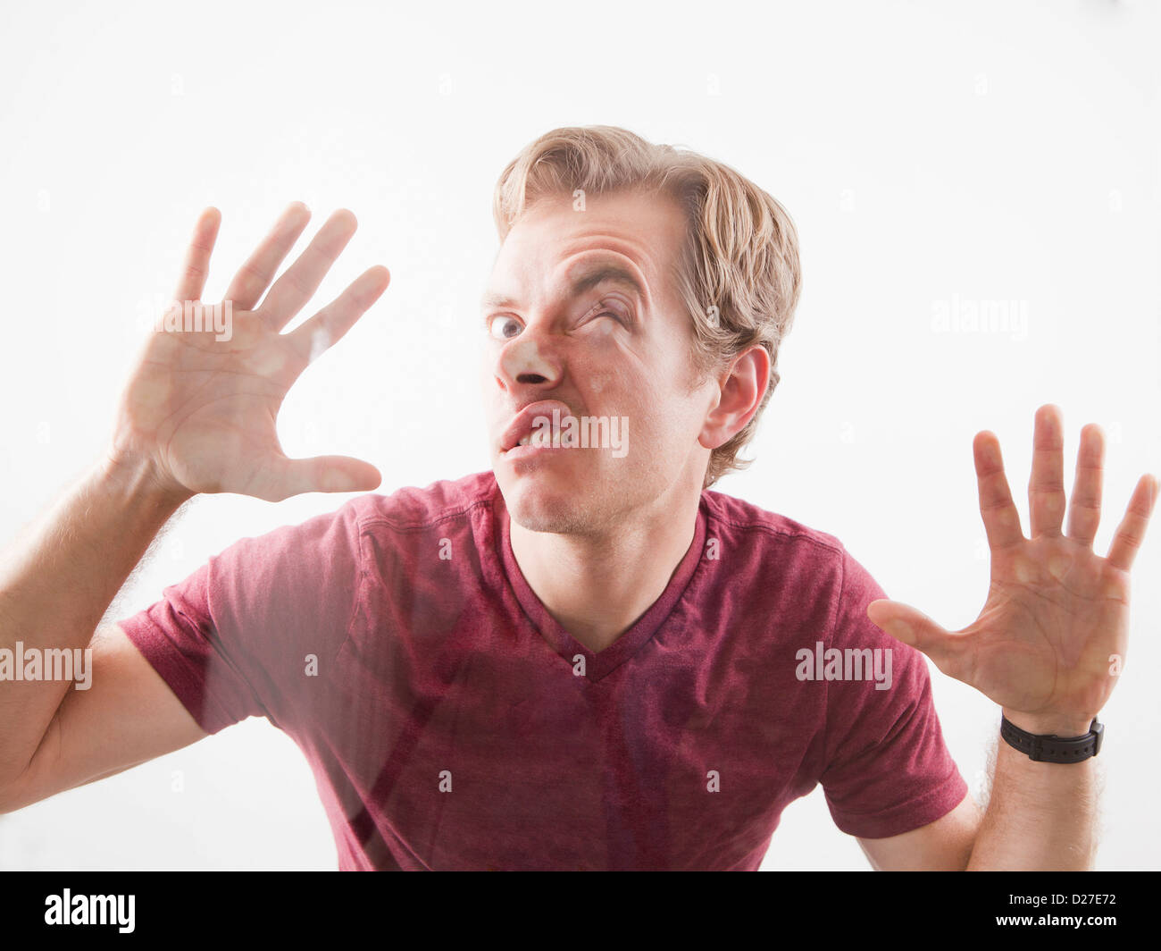 Man pushing his face and hands against glass Stock Photo: 53025254 - Alamy Man pushing his face and hands against glass Stock Photo: 53025254 - Alamy