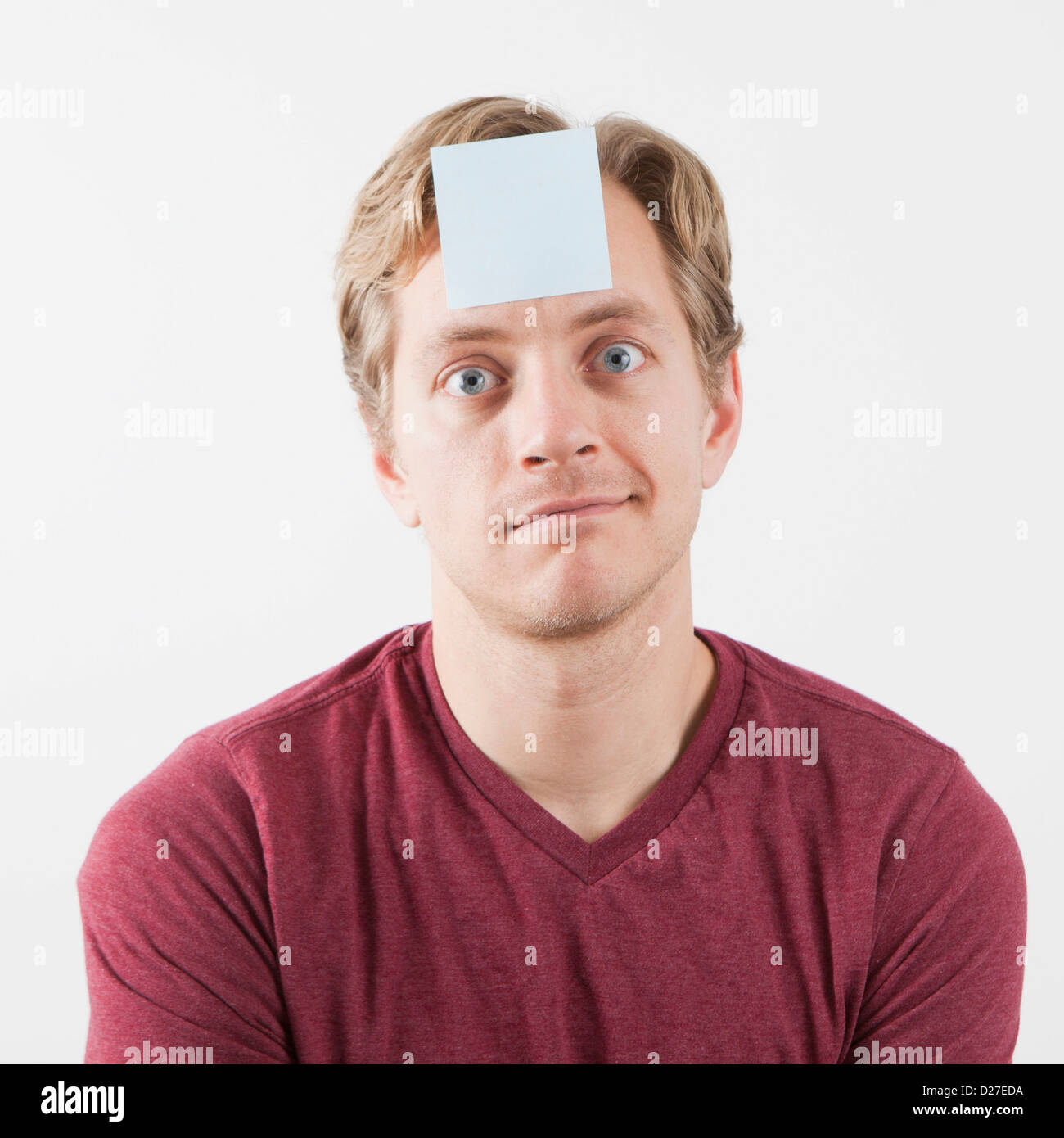 Man with adhesive note on his forehead Stock Photo - Alamy