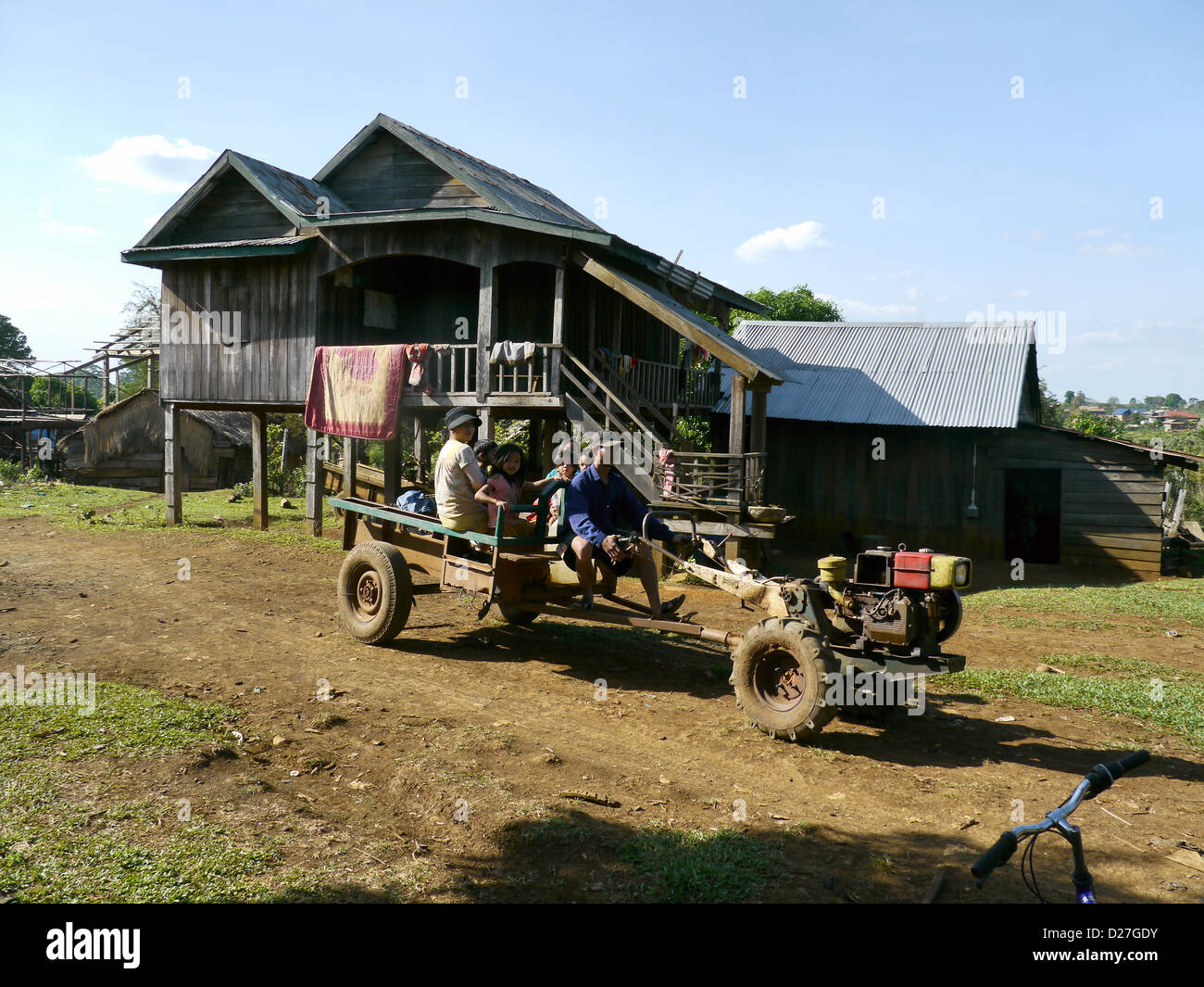 Cambodia - tractor entering village Stock Photo - Alamy