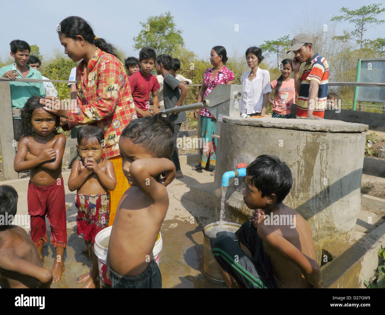 Cambodia - children washing at well Stock Photo - Alamy