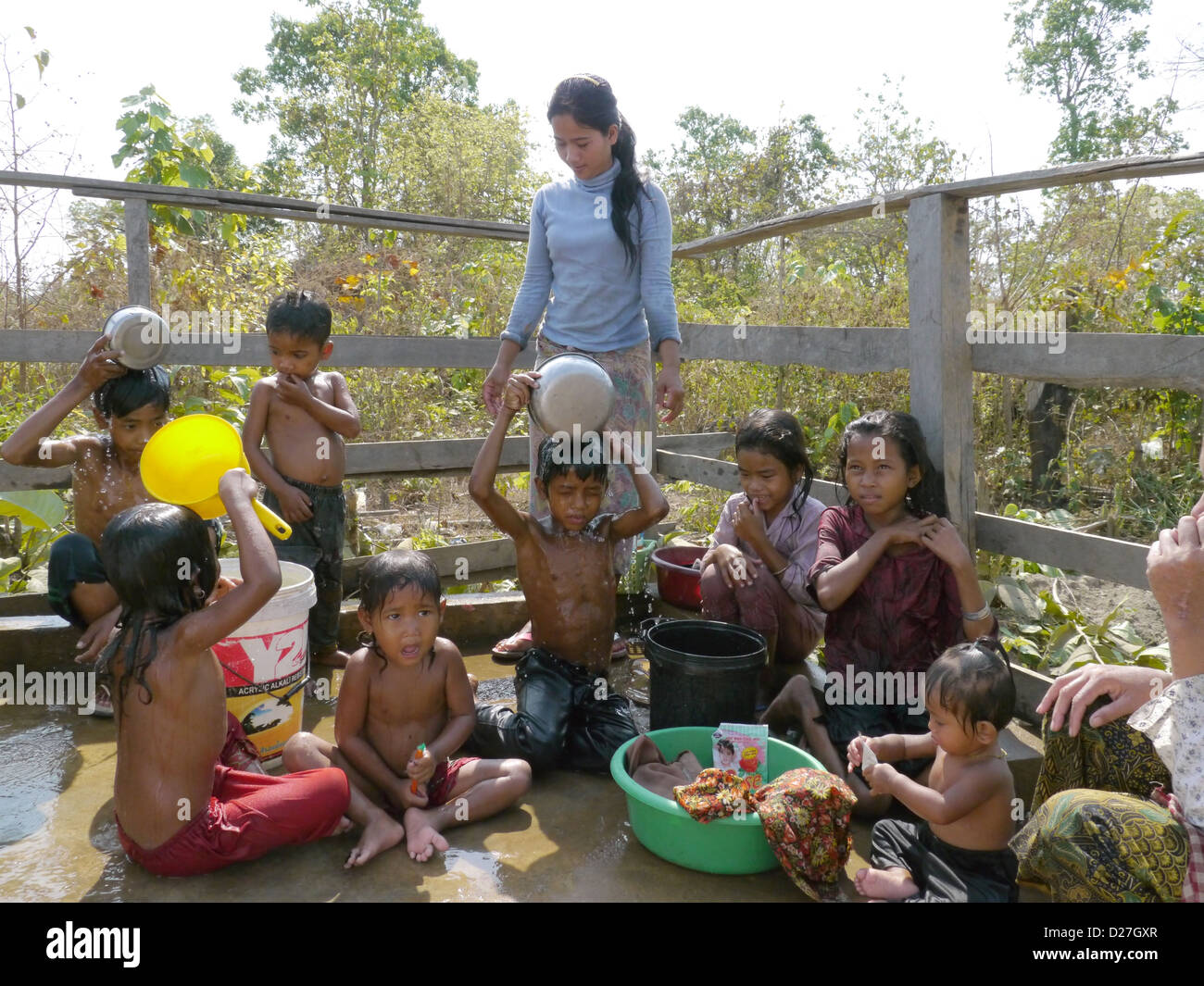 Cambodia - children washing at well Stock Photo - Alamy