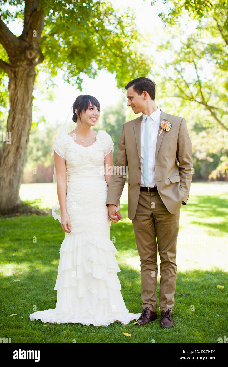 USA, California, San Francisco, Bride and groom strolling in park Stock ...