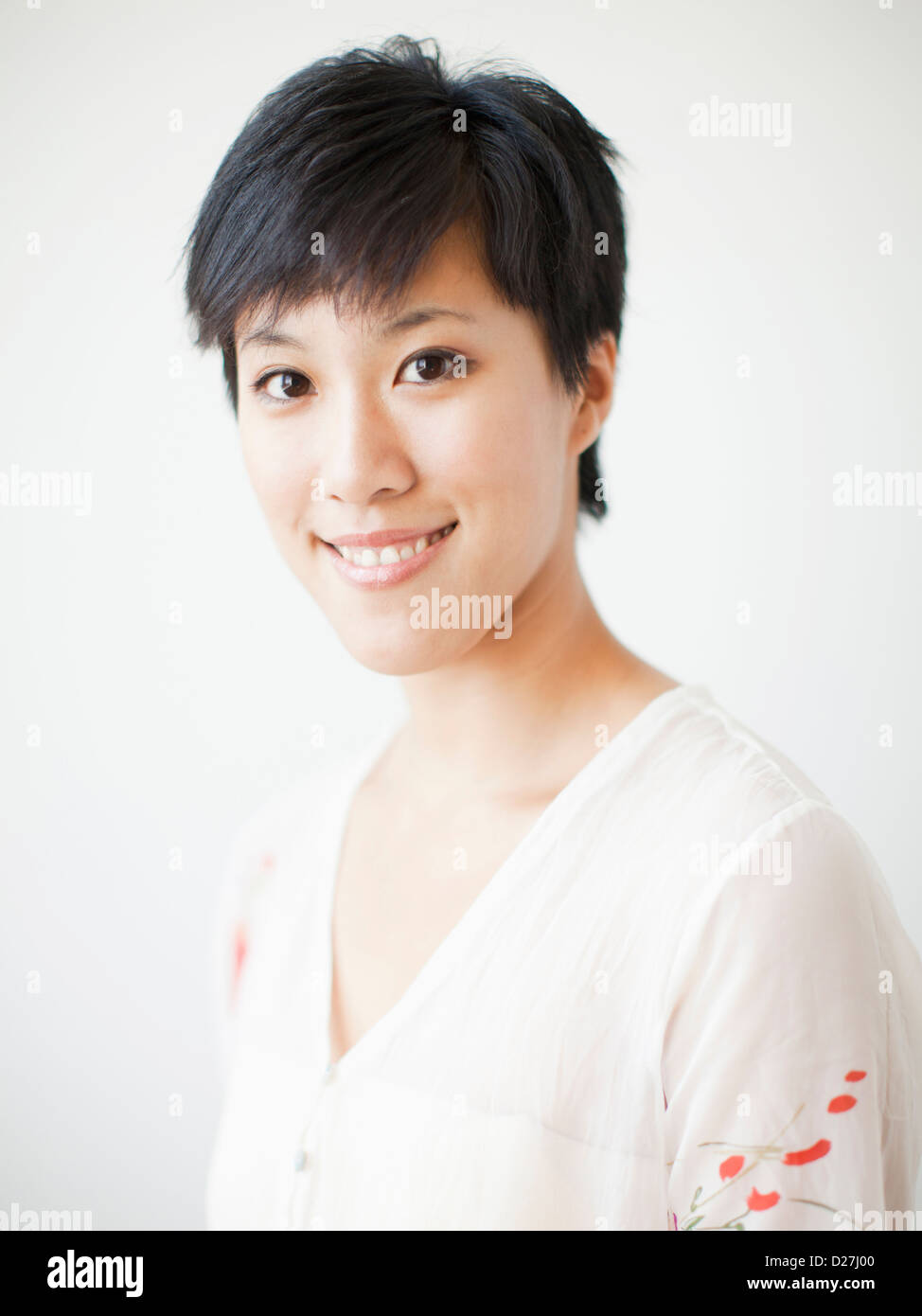 Studio portrait of smiling woman Stock Photo - Alamy