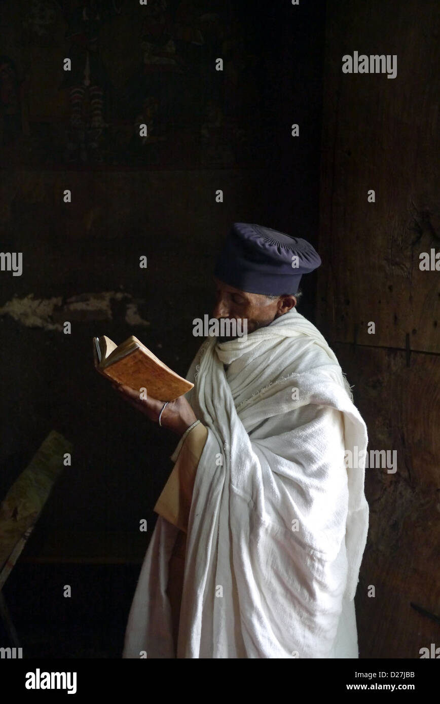 ETHIOPIA Guardian priest reading scriptures, Debre Berhan Selassie ...