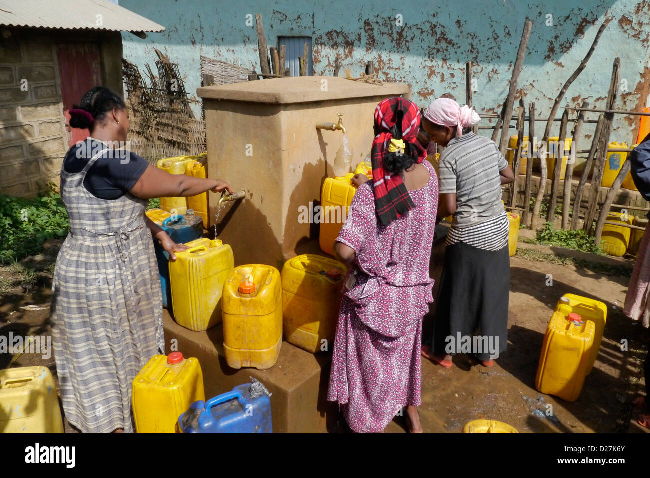 ETHIOPIA Women collecting water from a communal water point in Debate ...