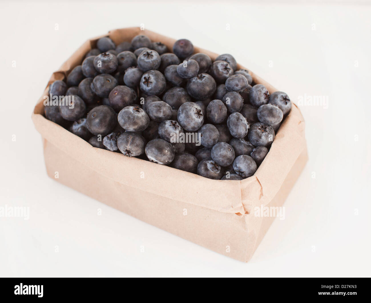 Carton of blueberries on white background Stock Photo - Alamy