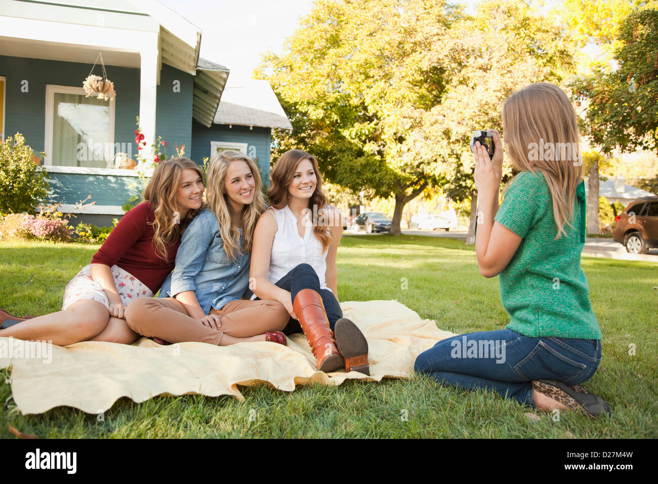 USA, Utah, Provo, Young woman taking picture of her friends Stock Photo ...