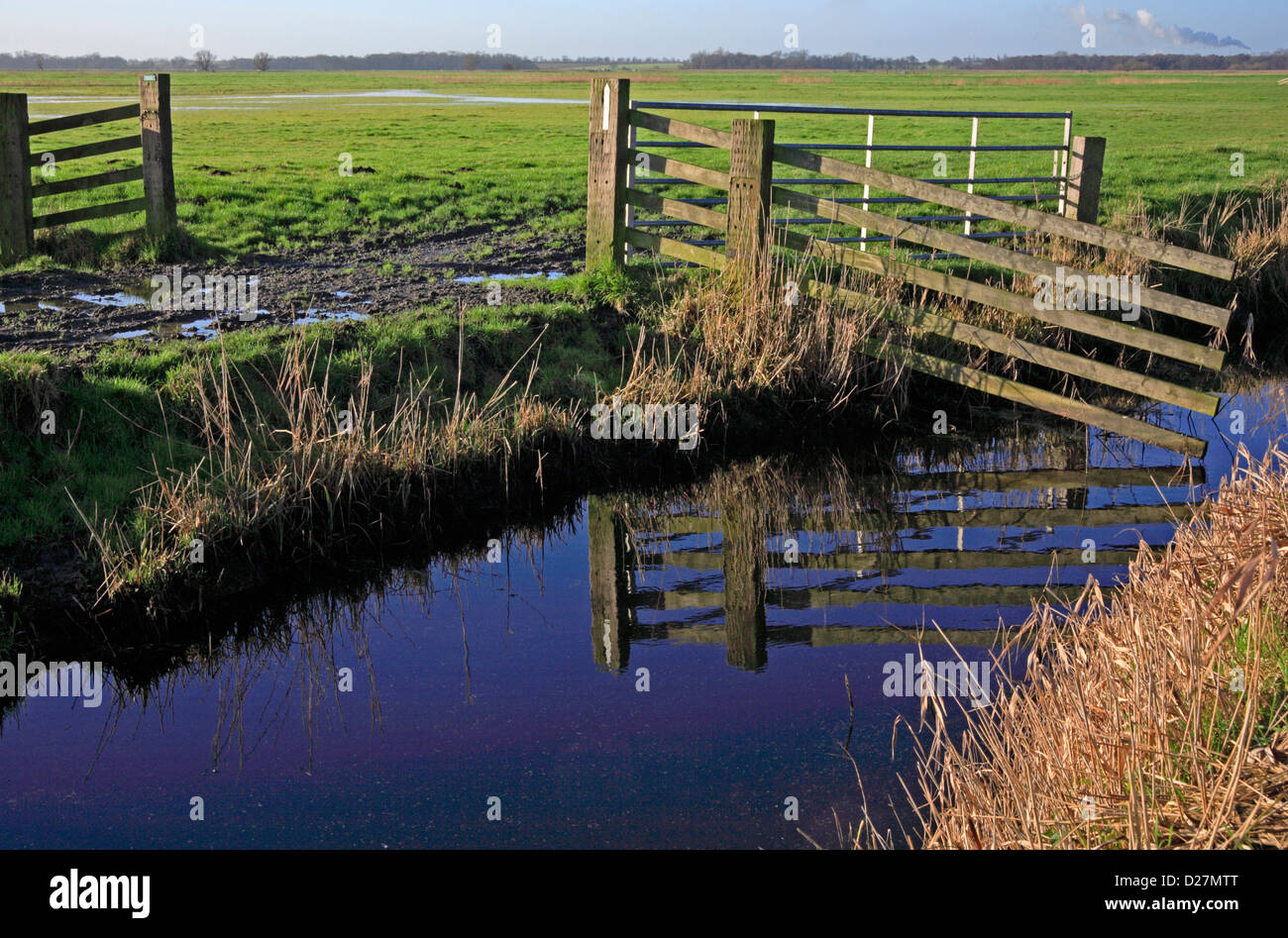 Farm gateway and cattle restraining fence over drainage channel at ...