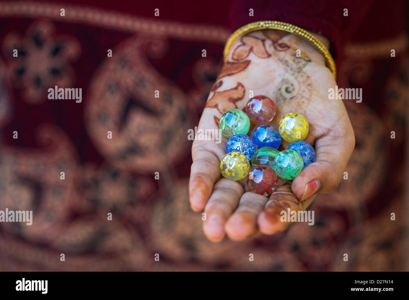 Hand holding marbles hi-res stock photography and images - Alamy