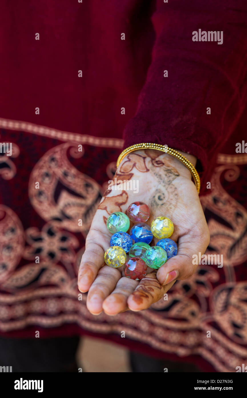 Hand holding marbles hi-res stock photography and images - Alamy