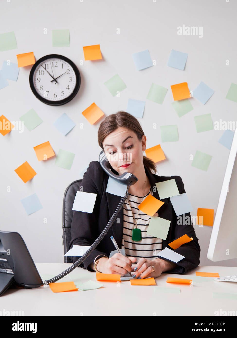 Computer and wall covered with post it notes hi-res stock photography ...