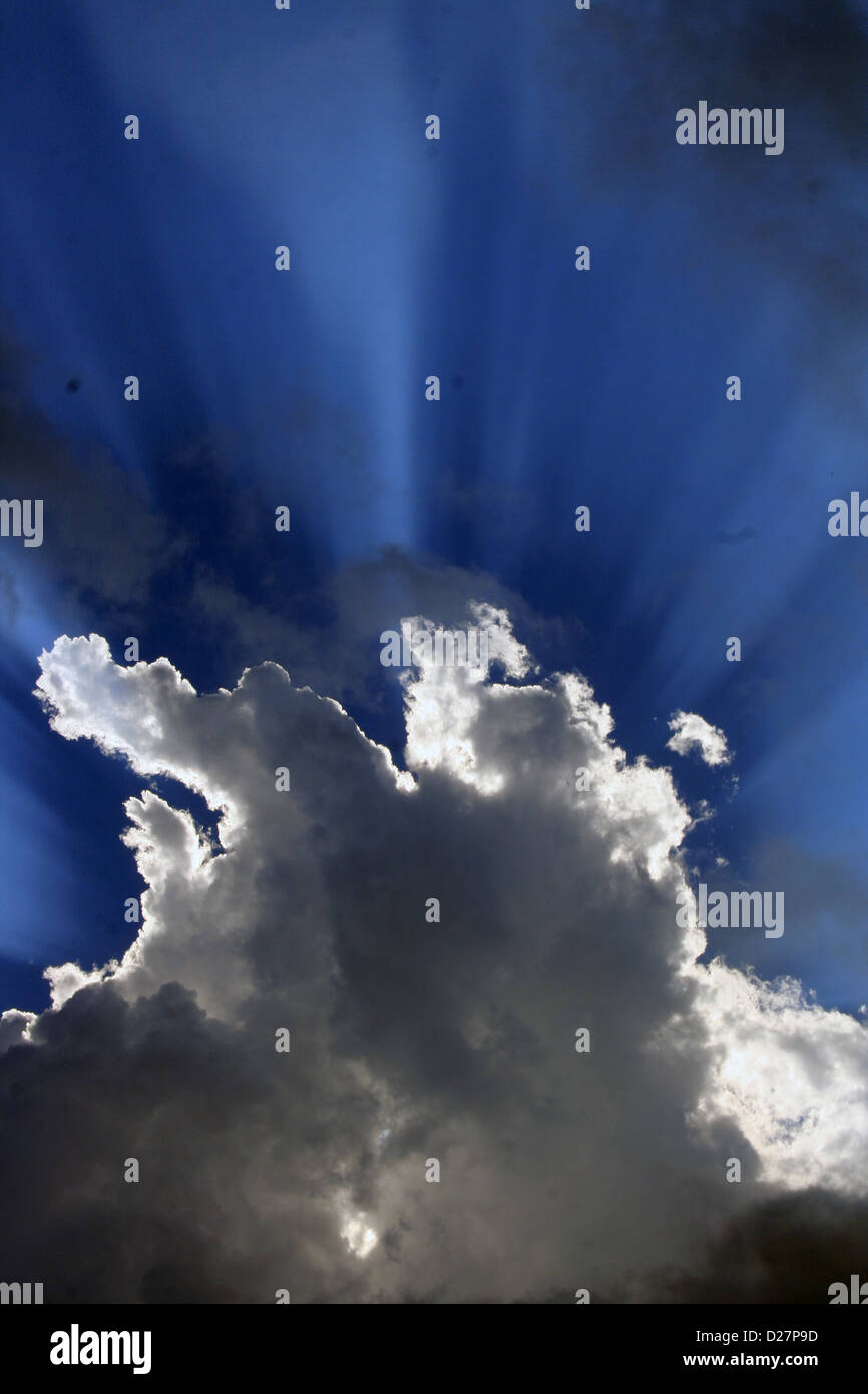 Sunshine streaming from behind a cloud in Cotacachi, Ecuador Stock ...