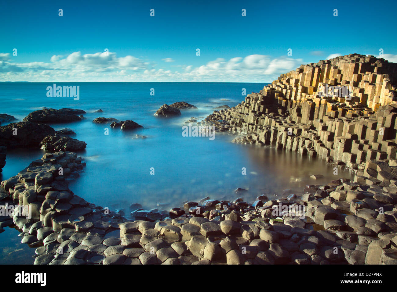 Beautiful day in the afternoon sun on the famous Giant's Causeway on ...