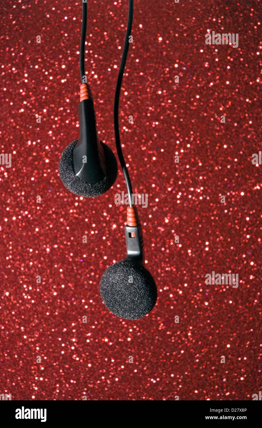 Earbuds Against Red Background Stock Photo - Alamy