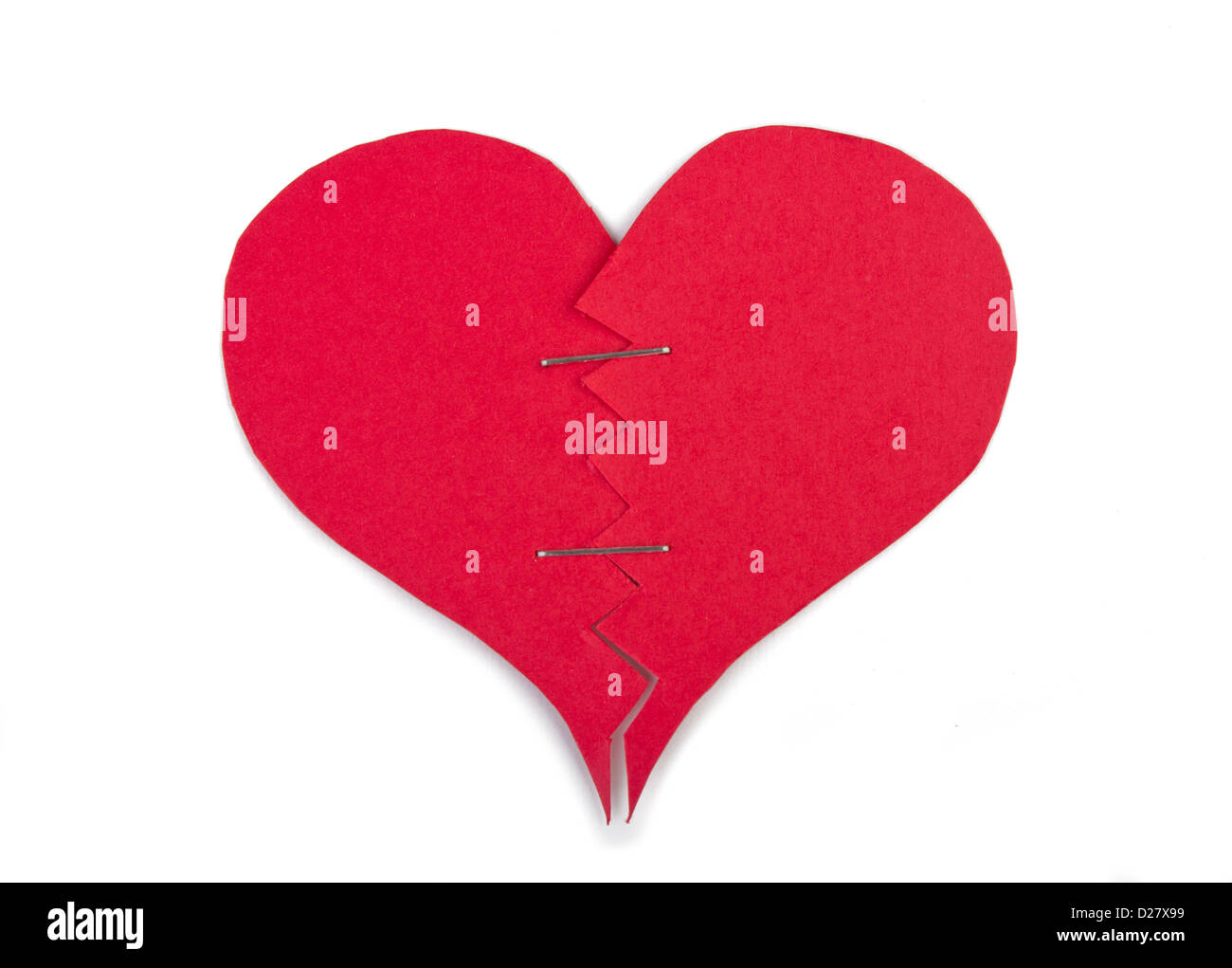 Paper heart repaired with staples Stock Photo - Alamy