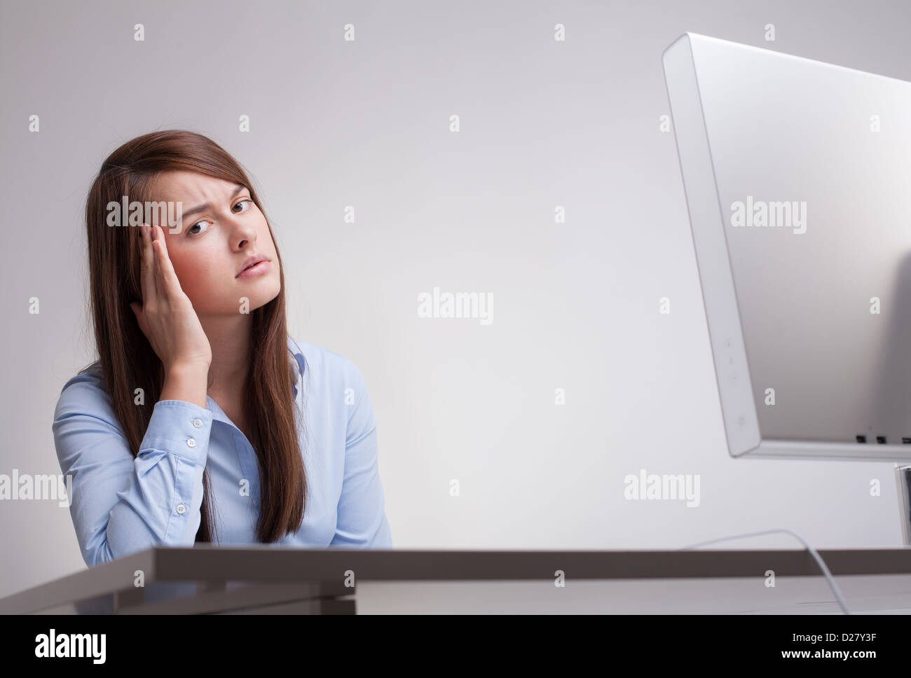Beautiful woman tired at work Stock Photo - Alamy