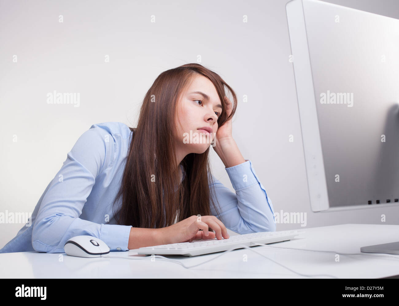 Beautiful woman tired at work Stock Photo - Alamy