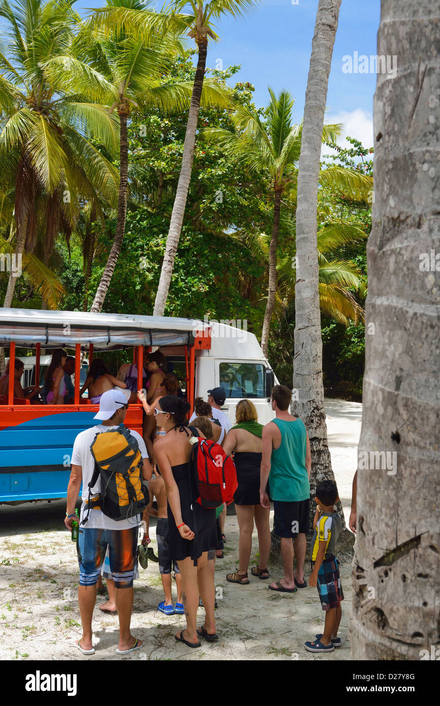 Tourists boarding a bus for a day trip, Punta Cana, Dominican Republic ...
