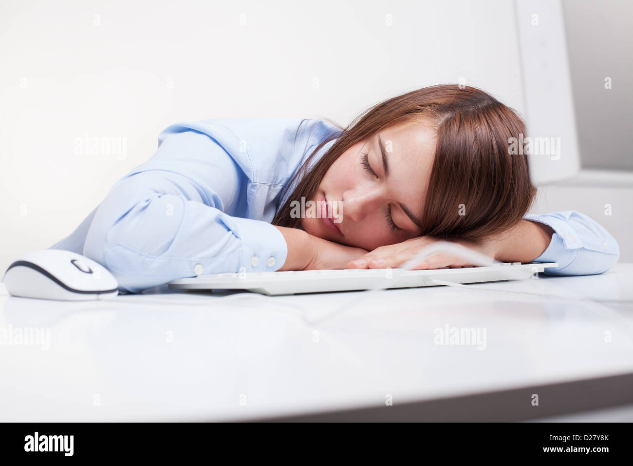 Beautiful woman tired at work Stock Photo - Alamy