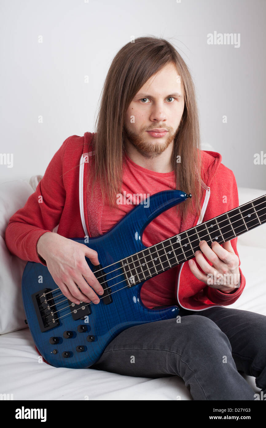 young guy playing guitar at home Stock Photo - Alamy