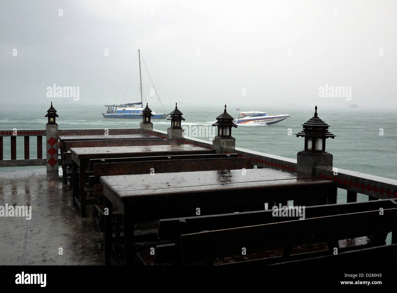 Heavy rain at an outdoor bar restaurant known as the "Beer Garden" in ...