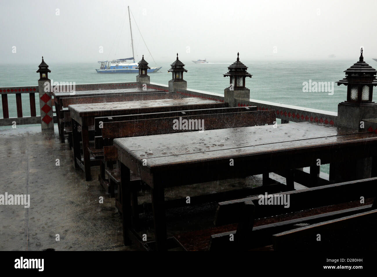 Heavy rain at an outdoor bar restaurant known as the "Beer Garden" in ...