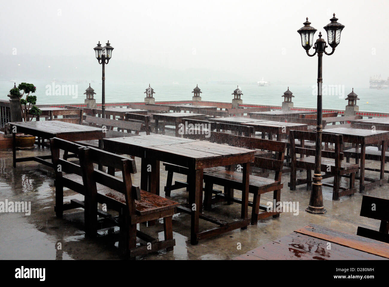 Heavy rain at an outdoor bar restaurant known as the "Beer Garden" in ...