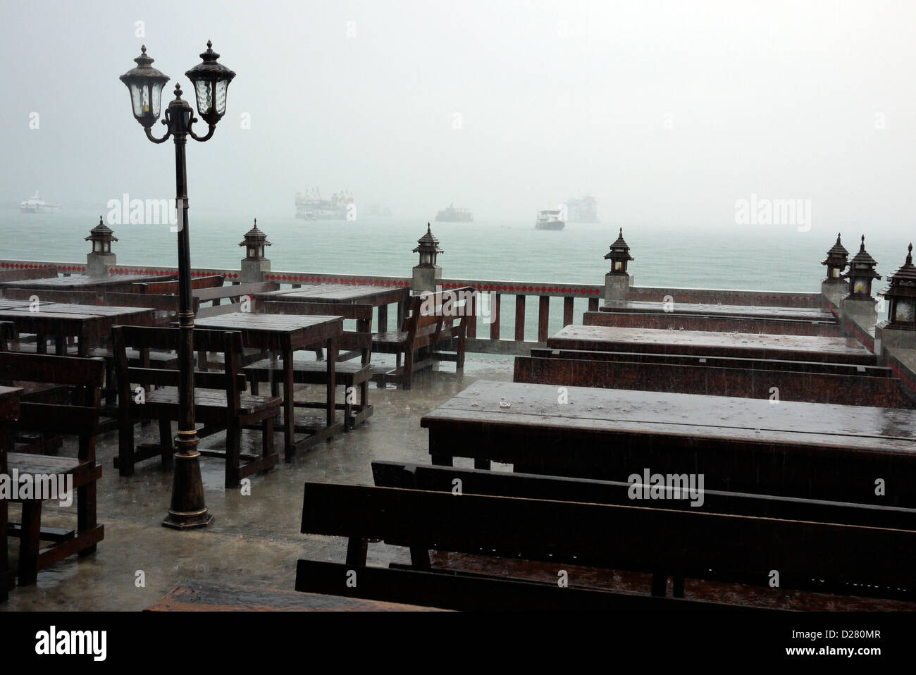 Heavy rain at an outdoor bar restaurant known as the "Beer Garden" in ...