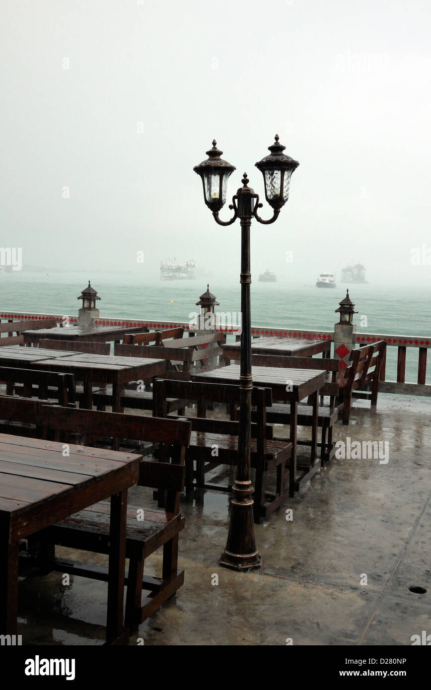 Heavy rain at an outdoor bar restaurant known as the "Beer Garden" in ...