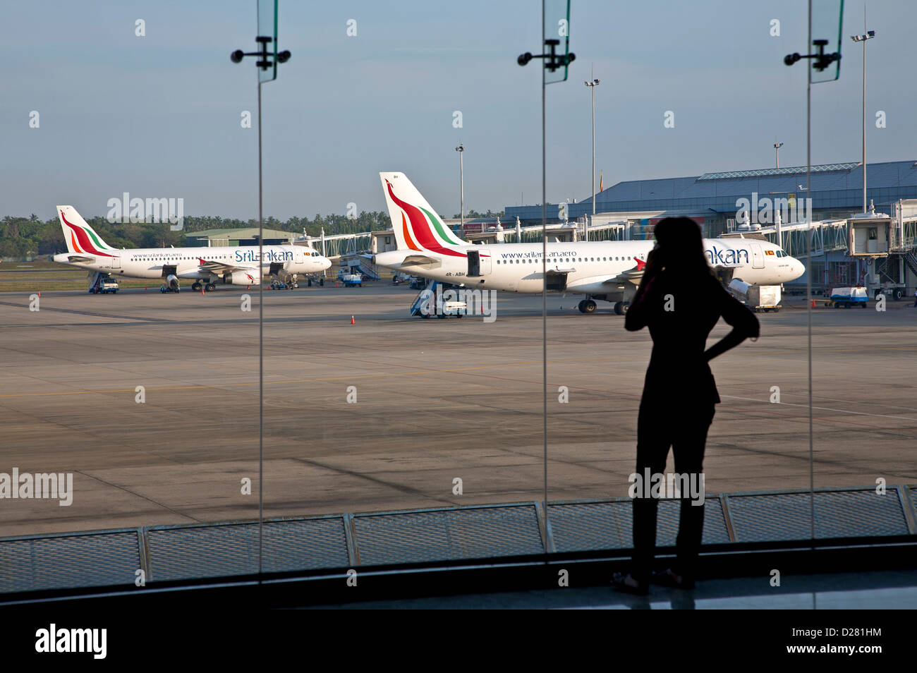 Woman making using a cell phone. Bandaranaike International Airport ...