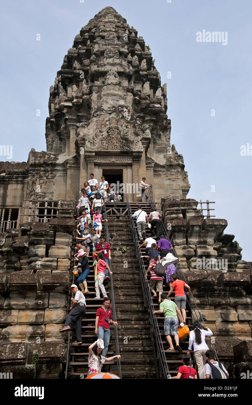 Tourists climbing the stairs. Angkor Wat temple. Cambodia Stock Photo ...