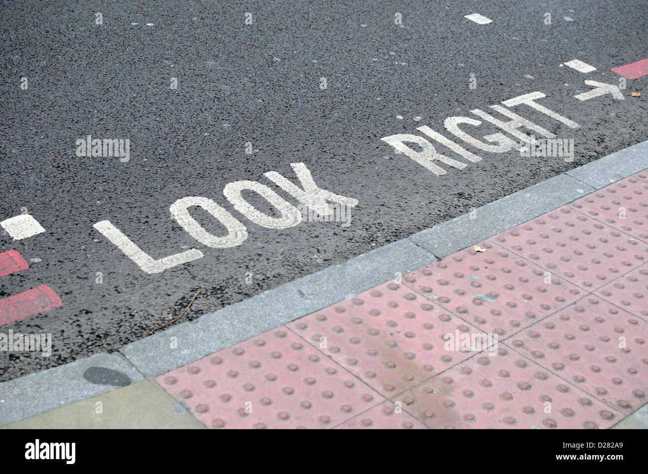 'Look Right' road markings on a UK road Stock Photo - Alamy