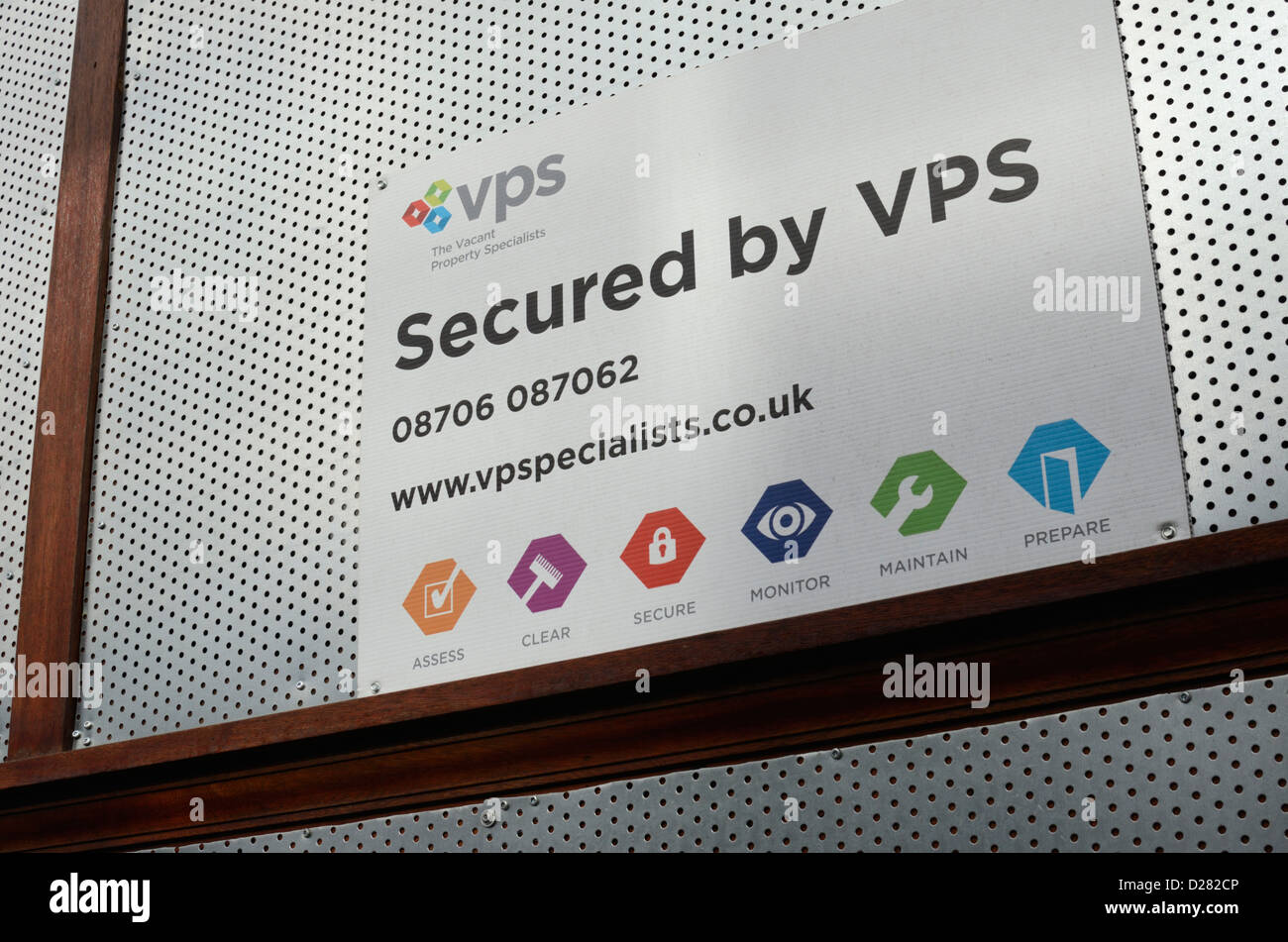 Security company sign outside a boarded up office building, London, UK ...