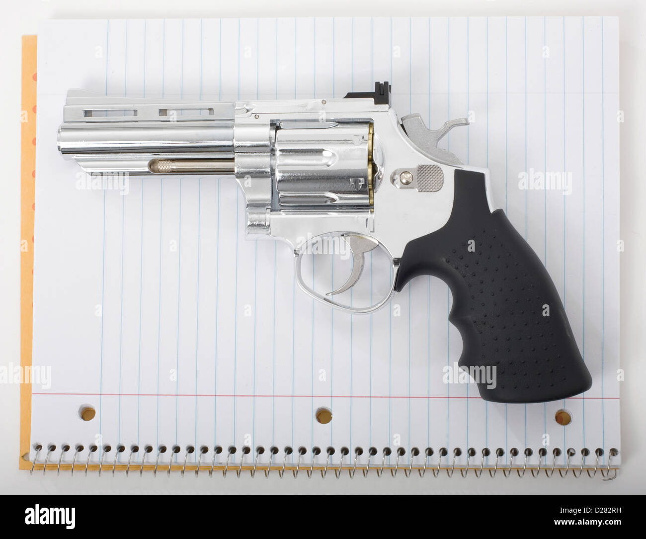 Handgun with school notebook paper Stock Photo - Alamy