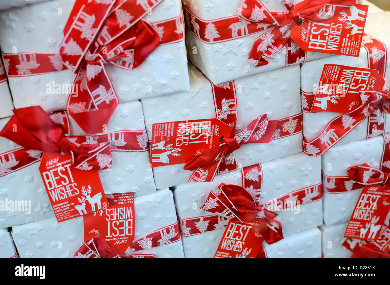 Christmas gift boxes in a shop window display Stock Photo - Alamy