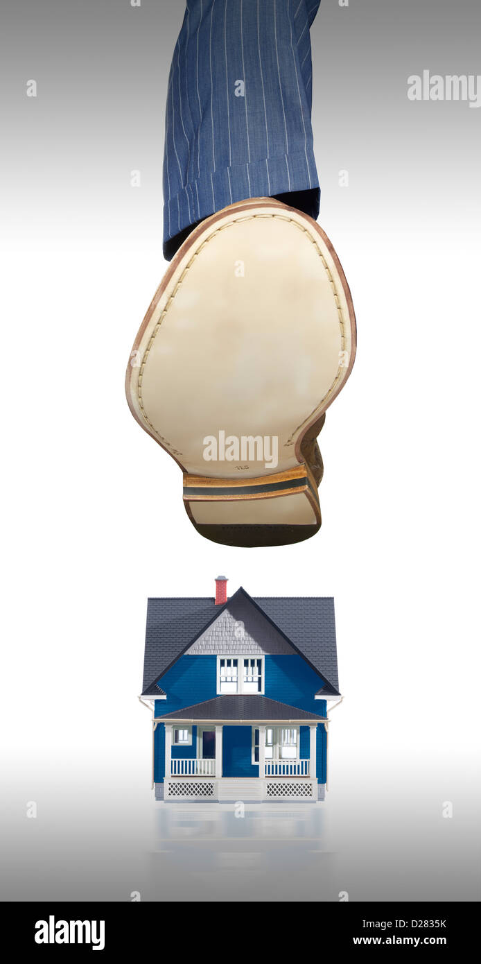 Male bankers foot stomping on a house. Denotes the housing crisis Stock ...