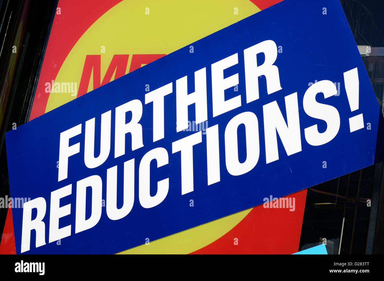 A shop window sign advertising 'further reductions' Stock Photo - Alamy