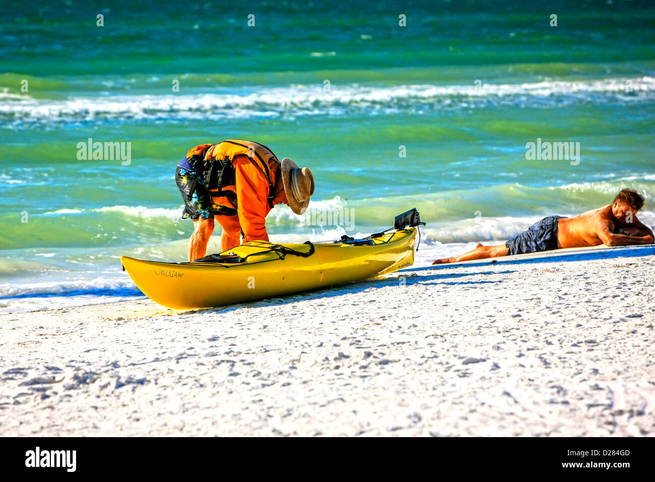 A man prepares his Kayak before entering the Gulf of Mexico at Siesta ...