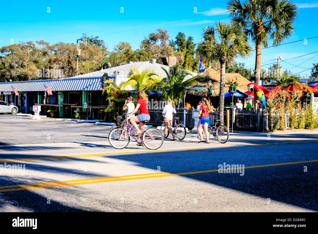 Young women on push bike hi-res stock photography and images - Alamy