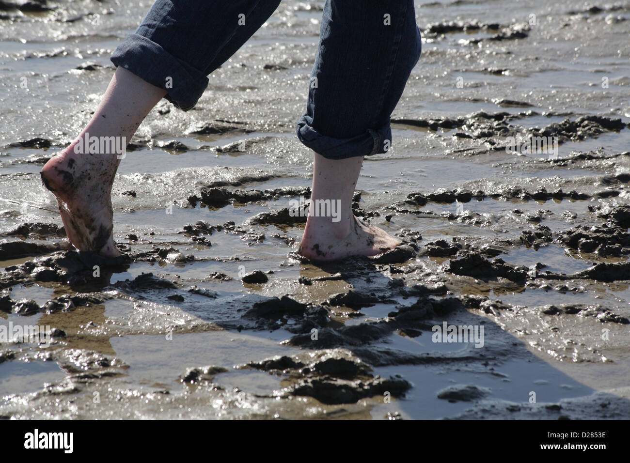 Woman walking barefoot in mud hi-res stock photography and images - Alamy