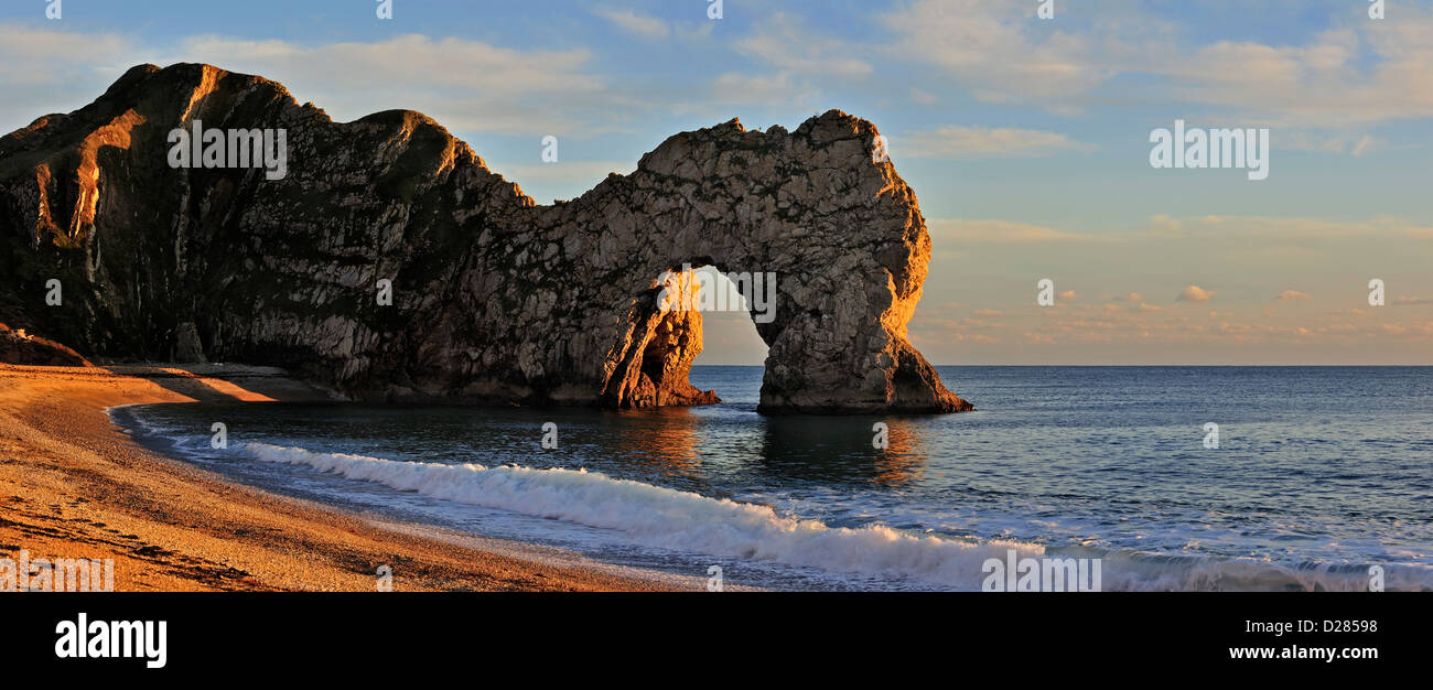 Durdle Door, a natural limestone arch at sunset along the Jurassic ...