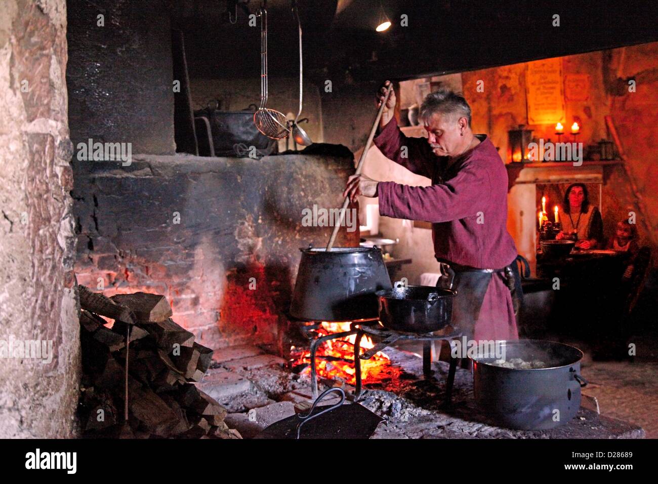 medieval cooking area, cooks in medieval clothing, medieval decorated ...