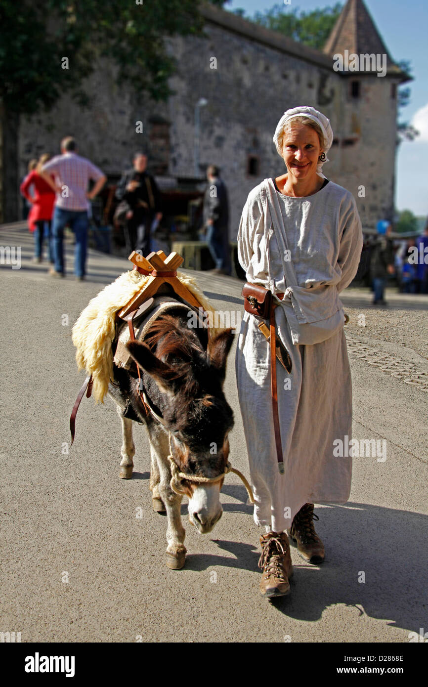 medieval dressed woman with donkey, Medieval Market, Ronneburg castle ...