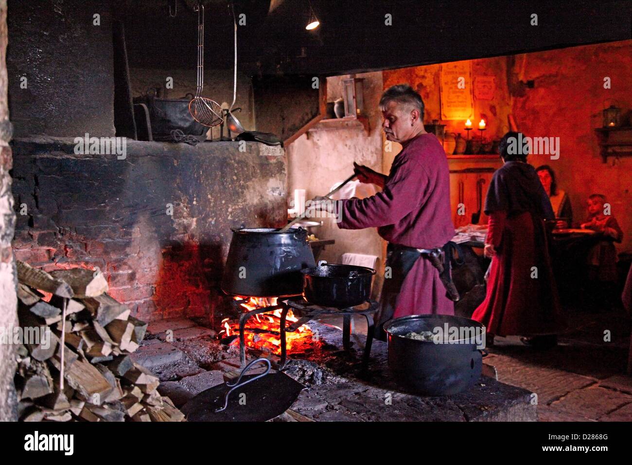 medieval cooking area, cooks in medieval clothing, medieval decorated ...