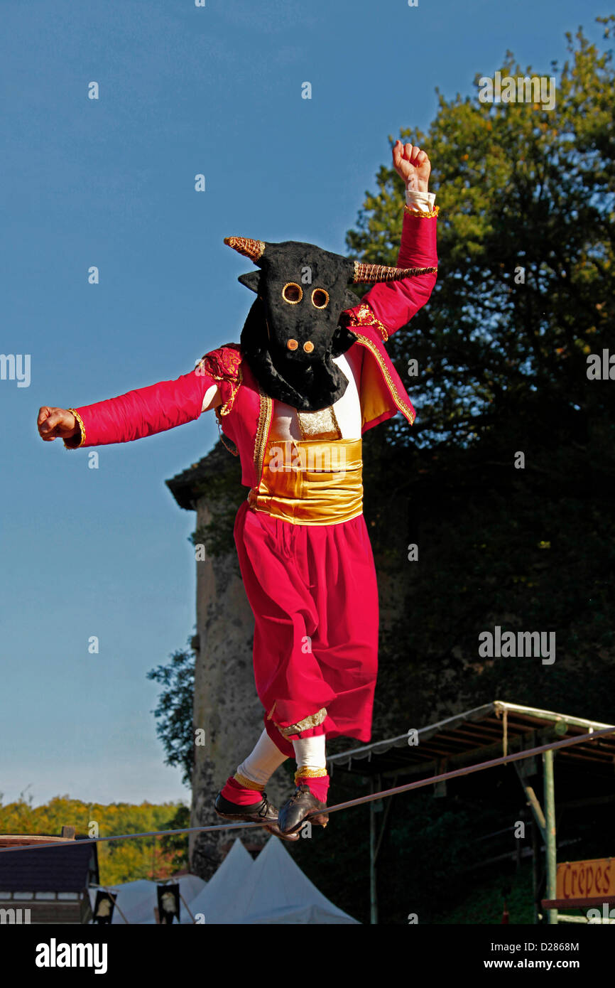 tightrope acrobat with bull s head, medieval market, Ronneburg castle ...