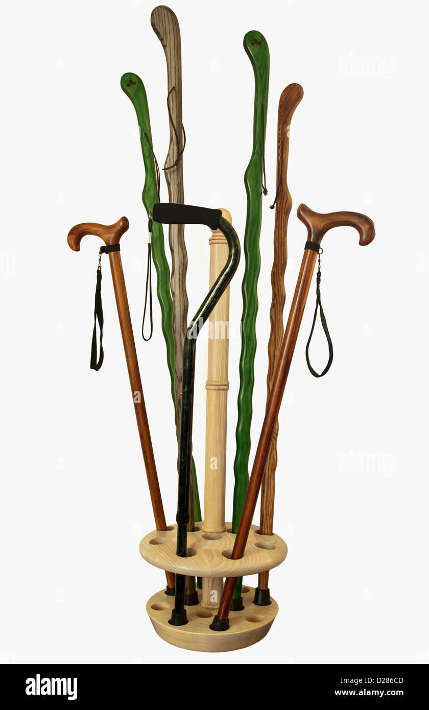 assorted canes and walking sticks in a wooden holder Stock Photo - Alamy